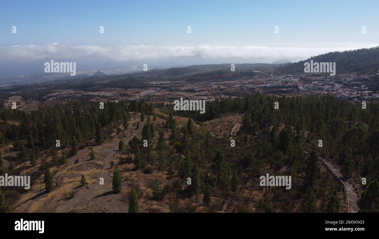 The high altitude farmland in Tenerife from above clouds, looking down ...