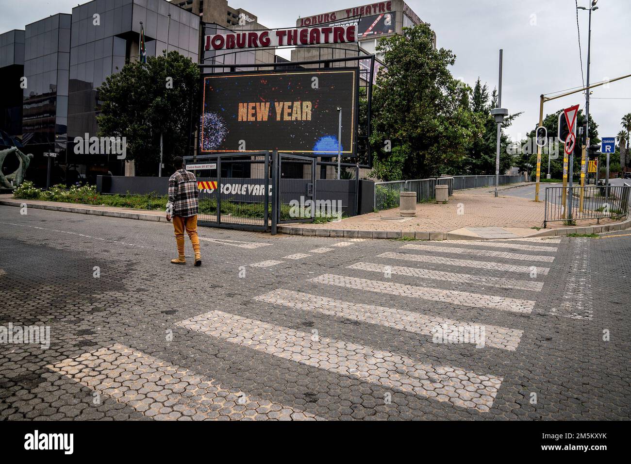 Johannesburg, South Africa. 29th Dec, 2022. A man walks past an ...