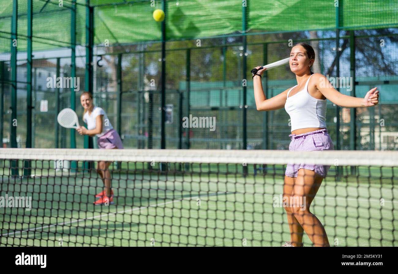 Two women tennis players playing padel Stock Photo - Alamy