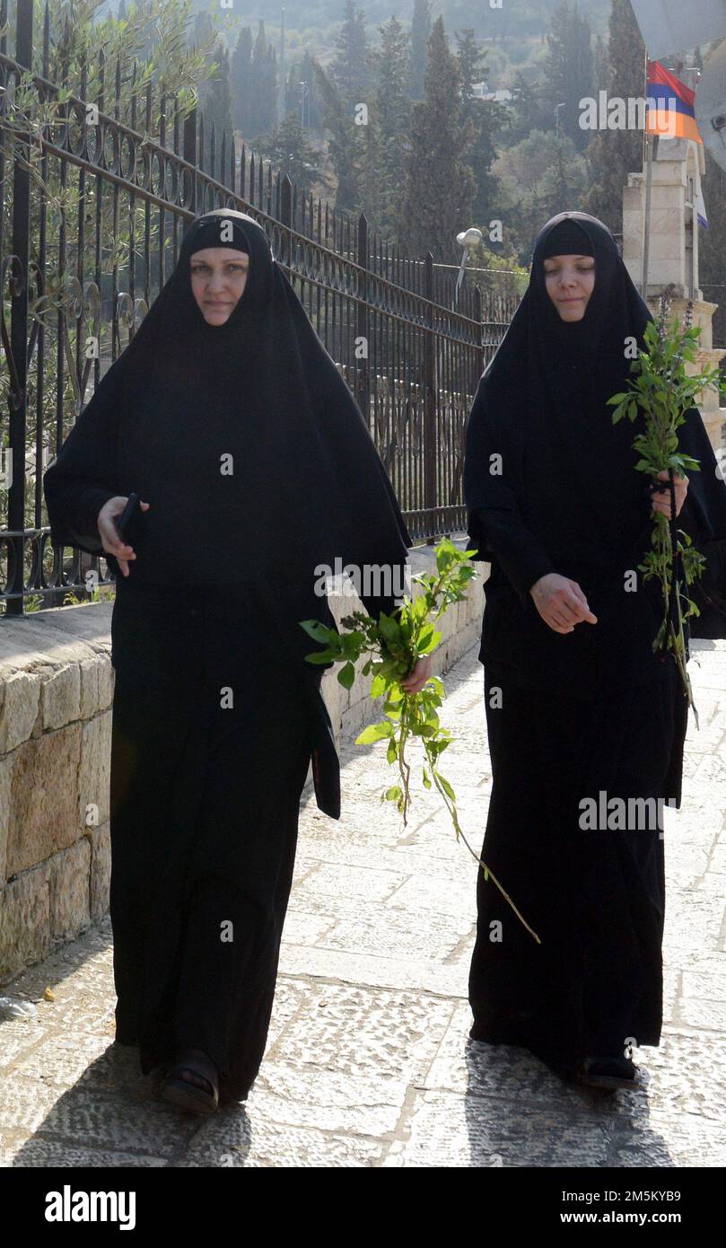 Orthodox Christian nuns walking in a procession from Tomb of the Virgin ...