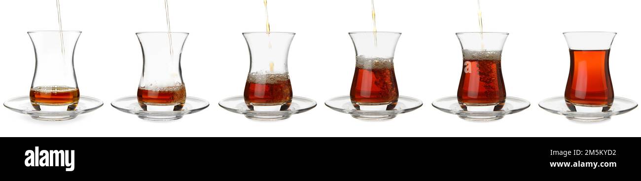 Process of pouring of tasty Turkish tea into glass cup on white ...