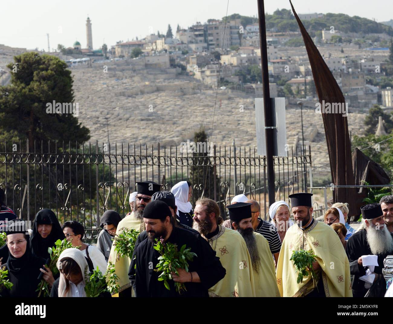 Greek Orthodox priests and nuns walking in a procession from the Tomb ...