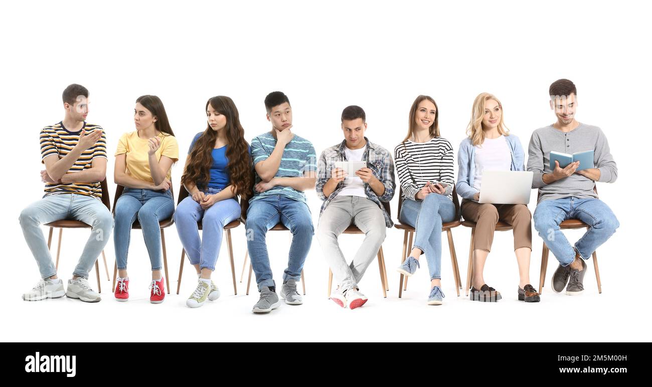 Many young people waiting in line on white background Stock Photo - Alamy