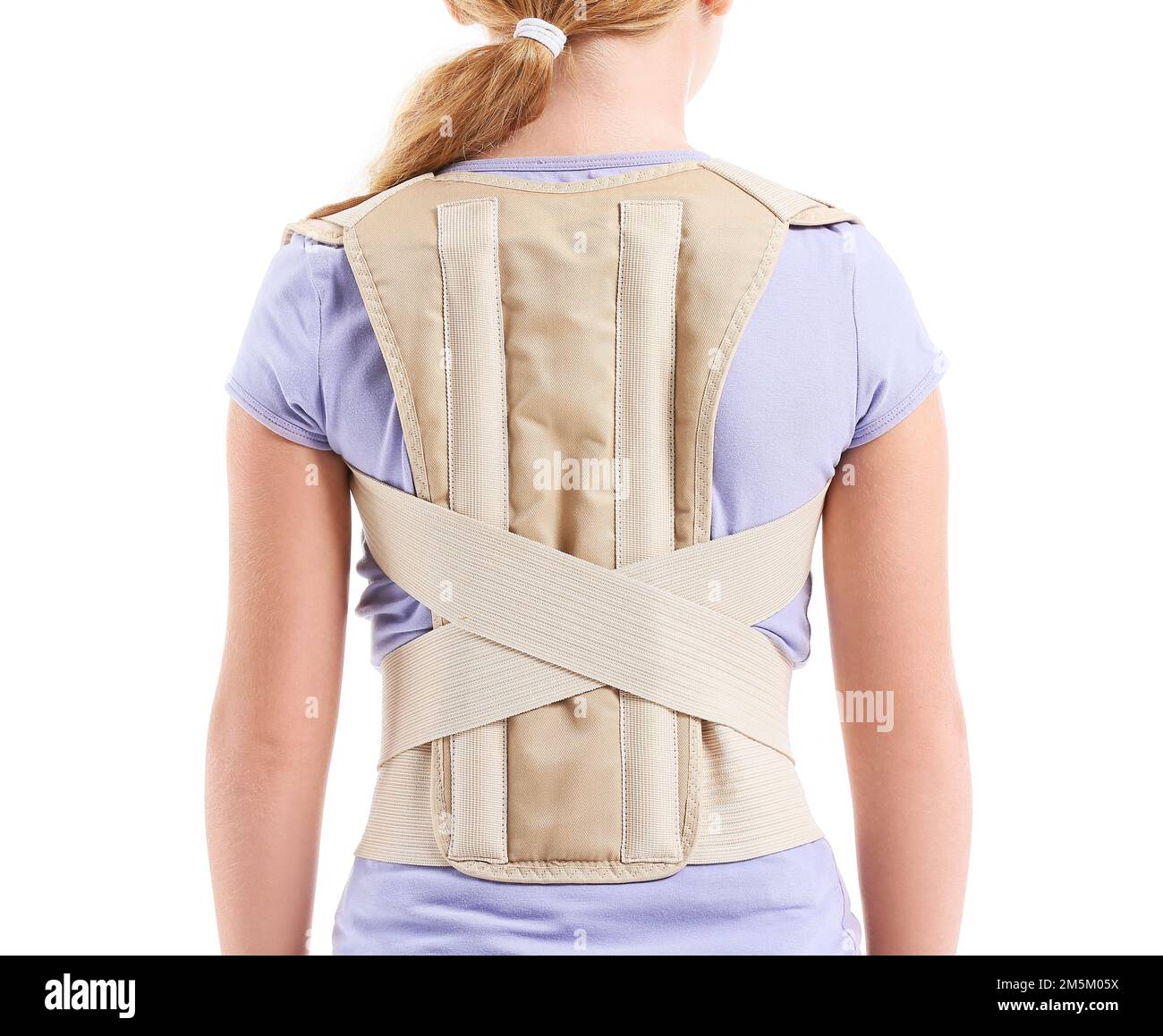 Little girl in back brace on white background Stock Photo - Alamy