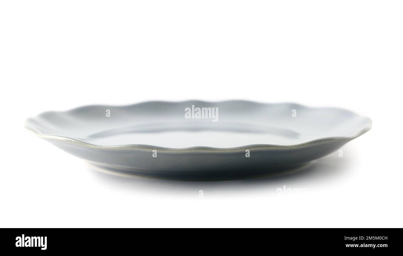 Stylish ceramic plate isolated on white background Stock Photo - Alamy