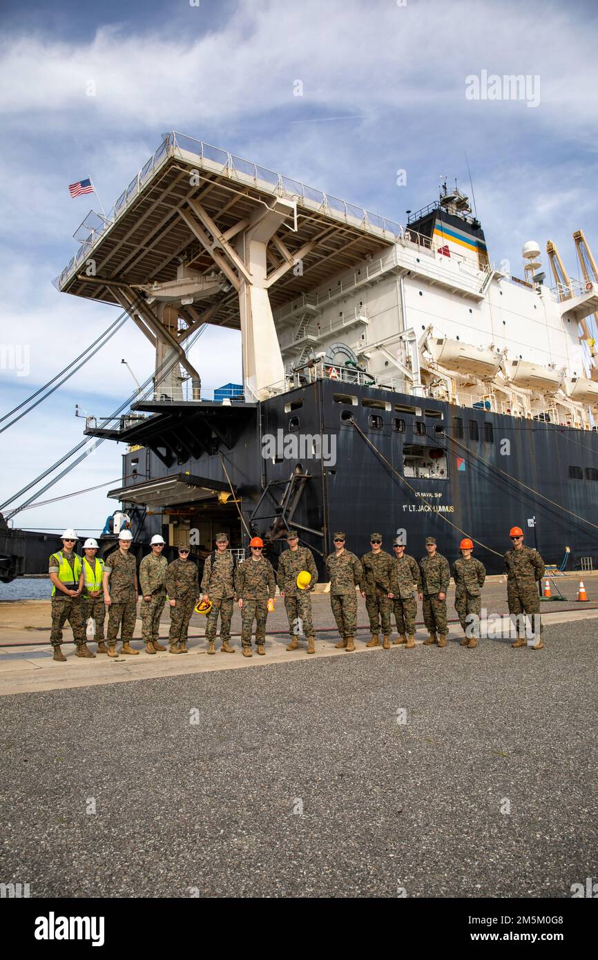 U.S. Marines participating in Atlantic Dragon pose for a photo aside ...