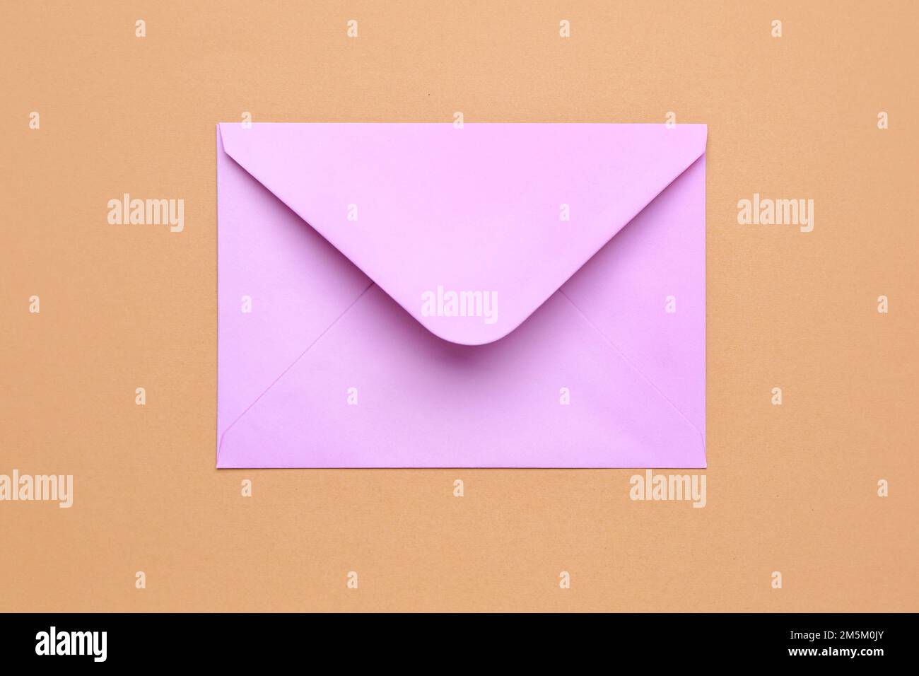 Pink envelope on color background Stock Photo - Alamy