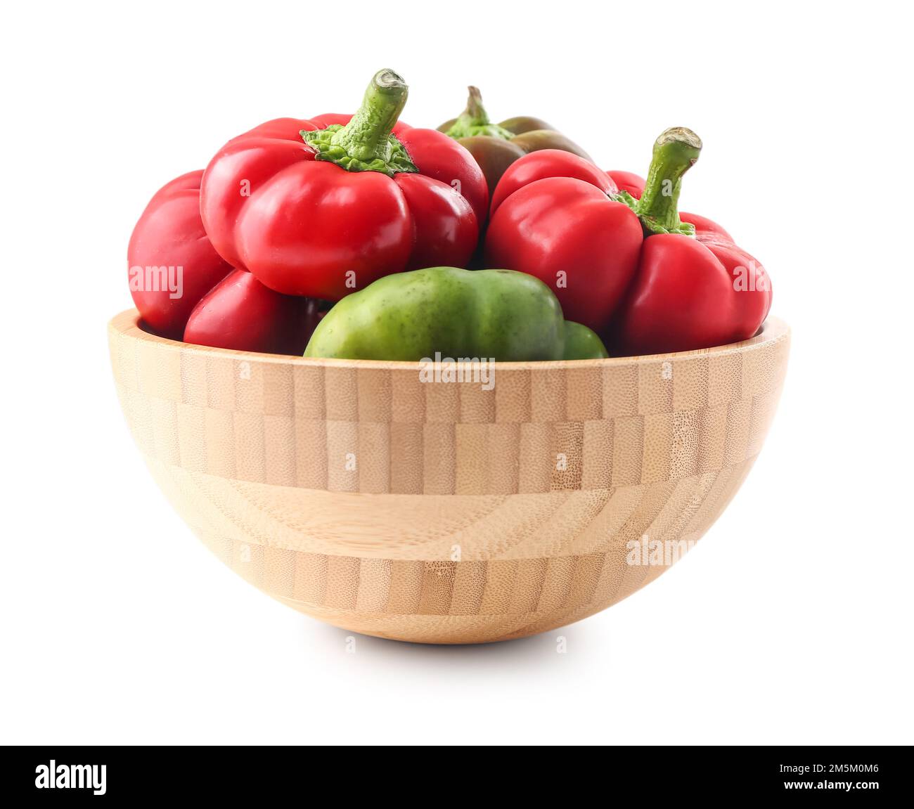 Wooden bowl of fresh bell peppers on white background Stock Photo - Alamy