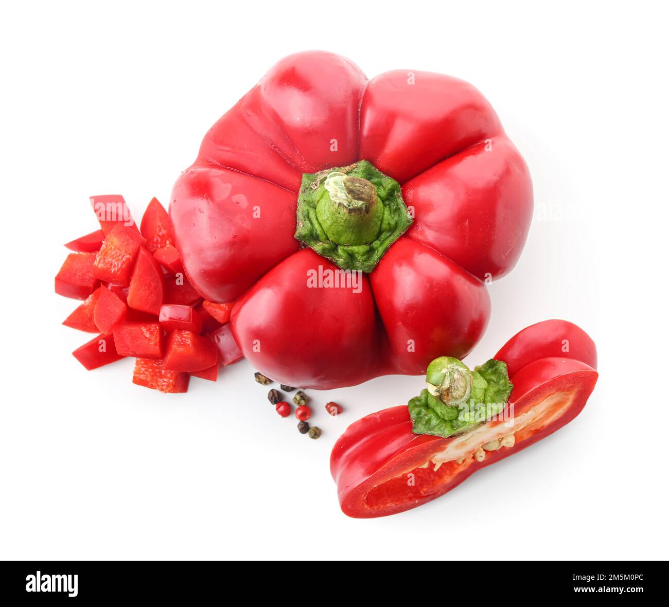 Whole and cut red bell peppers on white background Stock Photo - Alamy