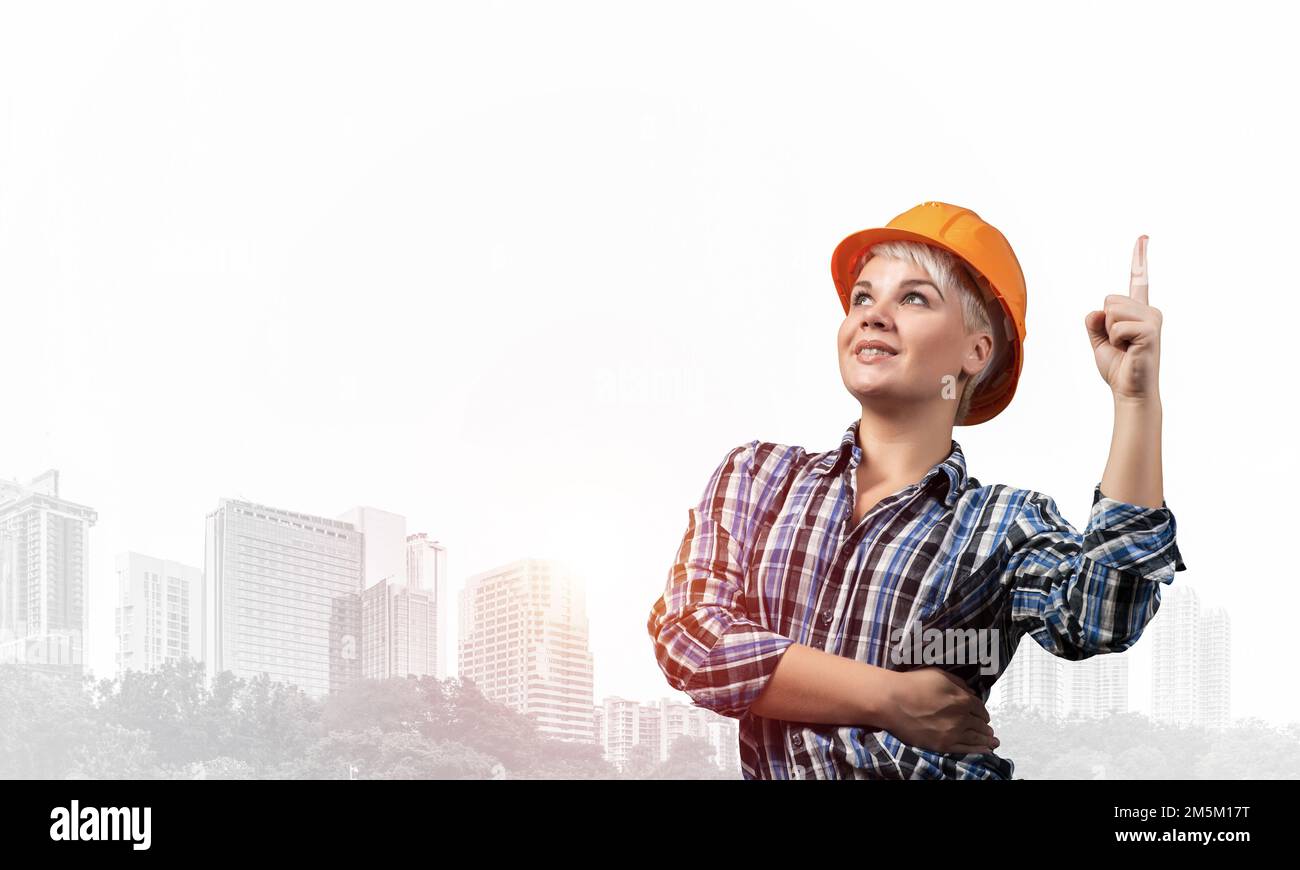 Beautiful female builder in hardhat Stock Photo - Alamy