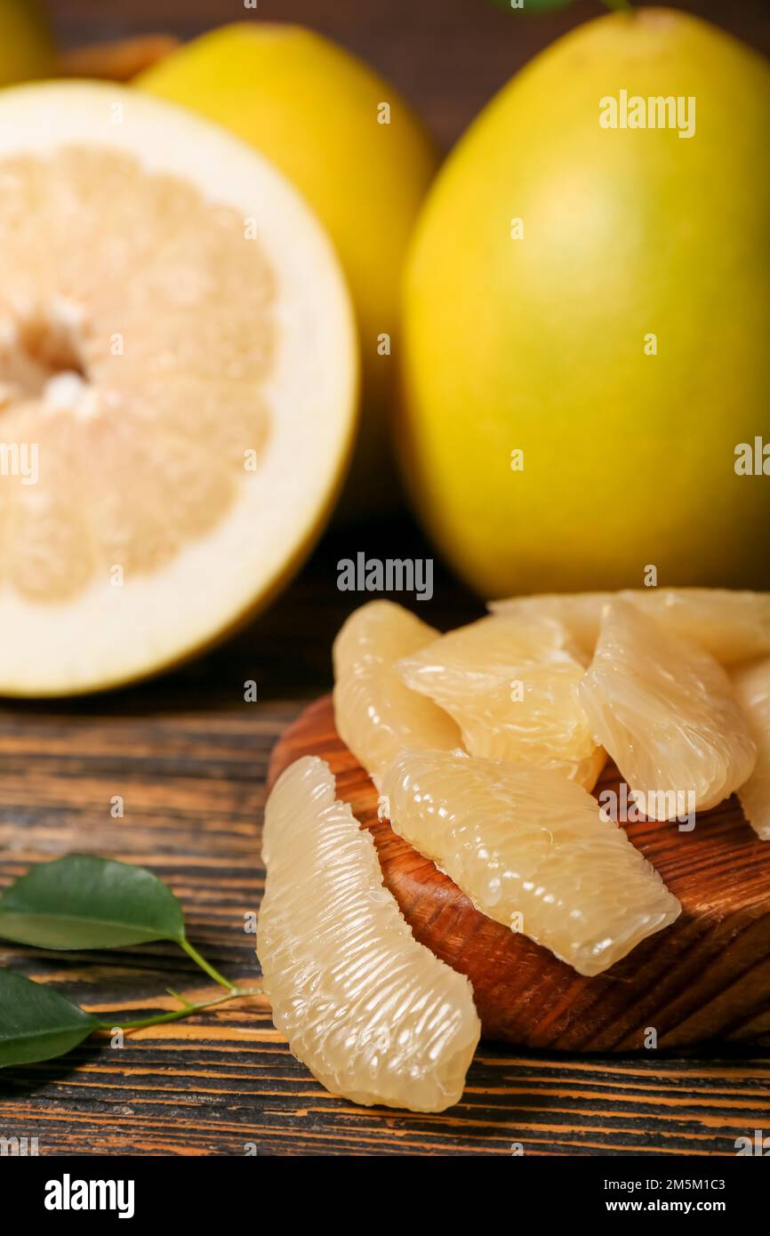 Slices of tasty pomelo fruit on table, closeup Stock Photo - Alamy