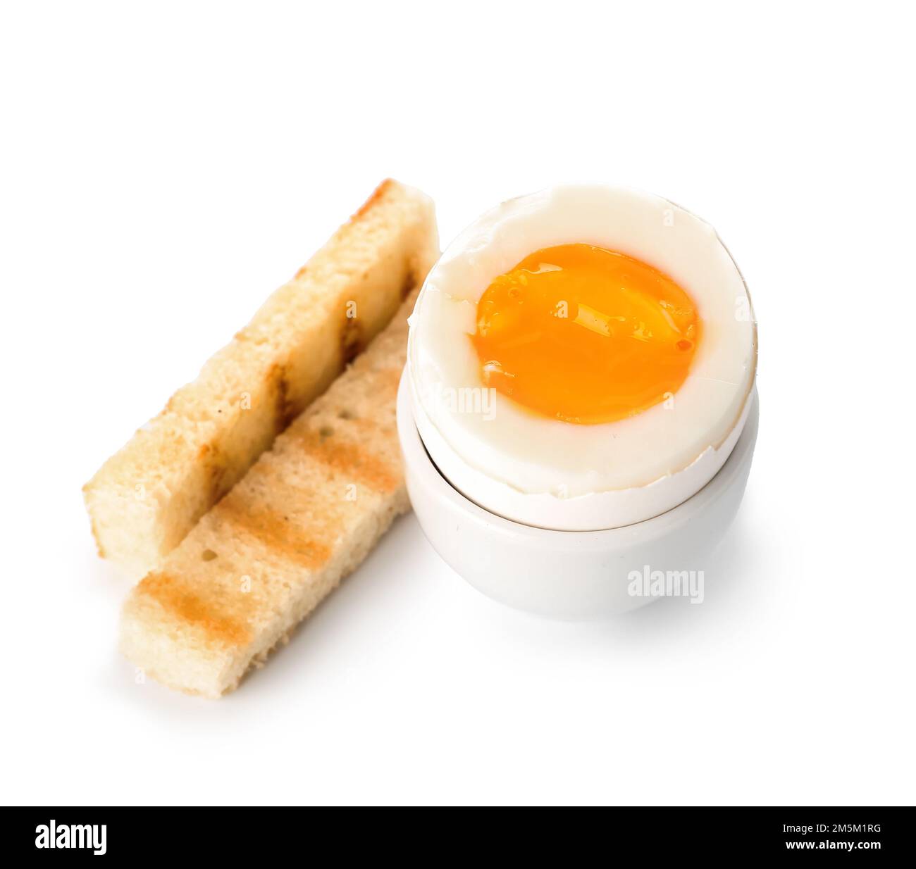 Holder with soft boiled egg and toasted bread on white background Stock ...