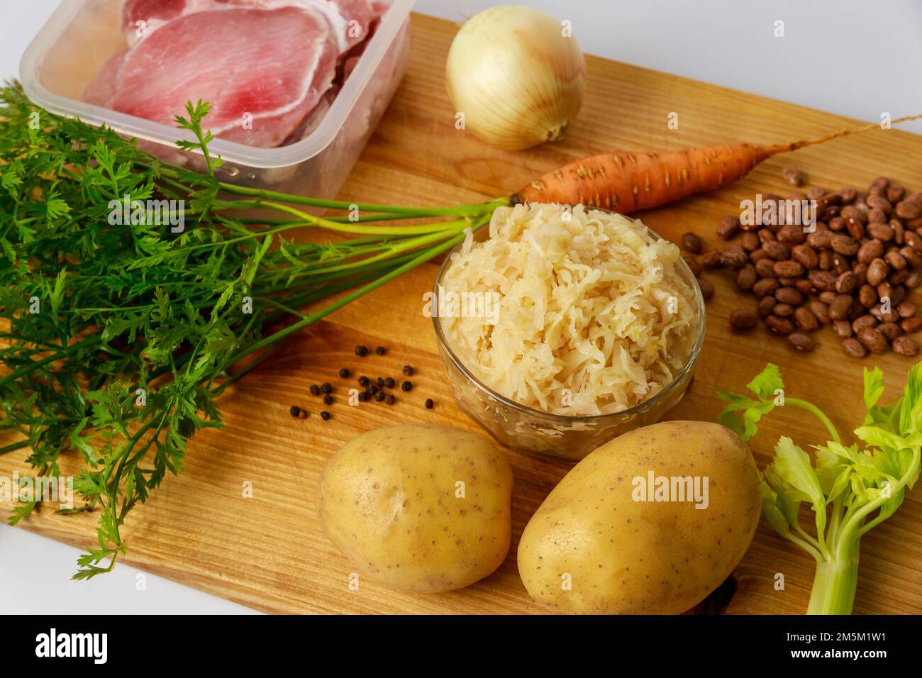 Prepared Ingredients for making sauerkraut soup Stock Photo - Alamy
