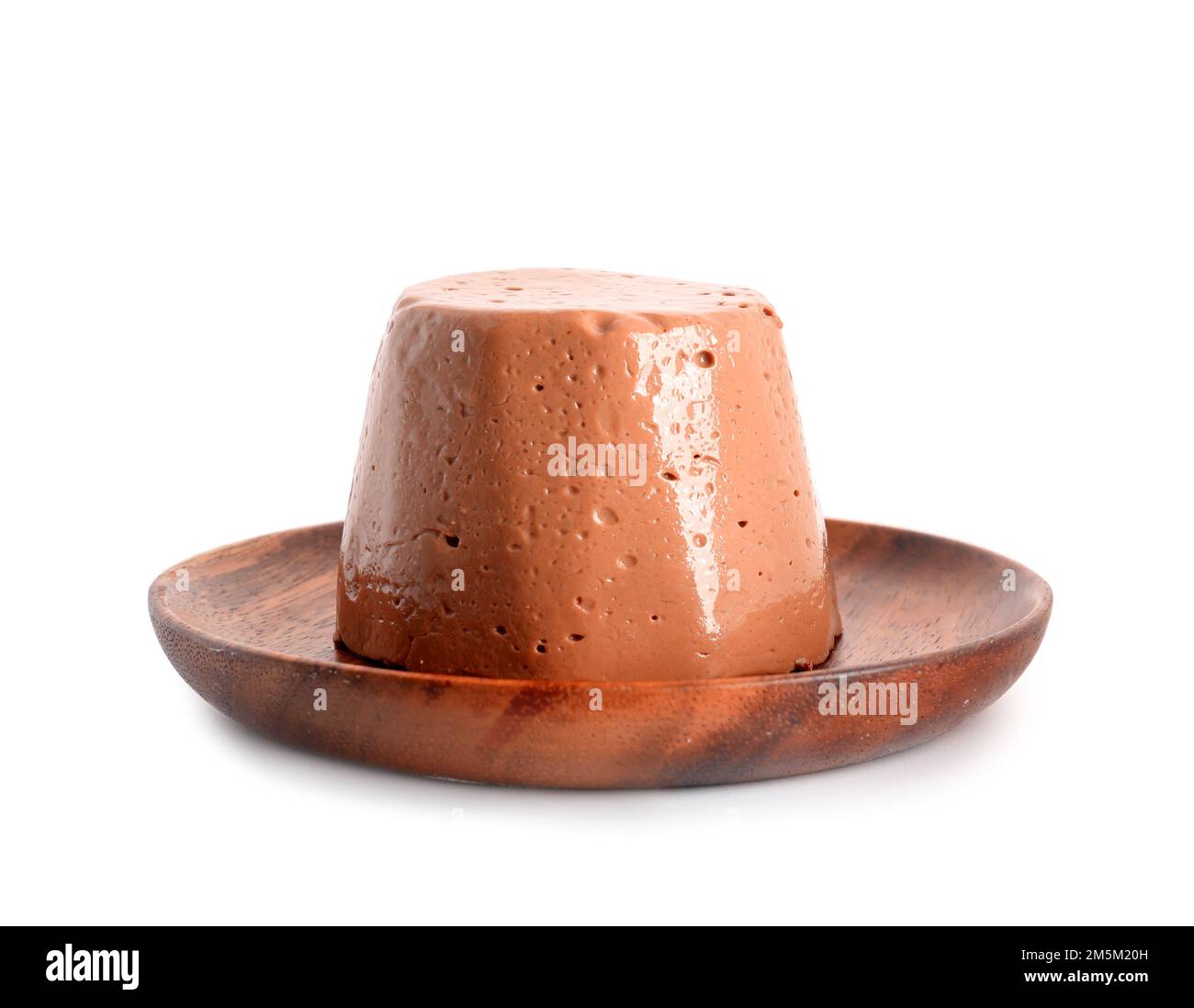 Delicious chocolate pudding on wooden plate isolated on white ...