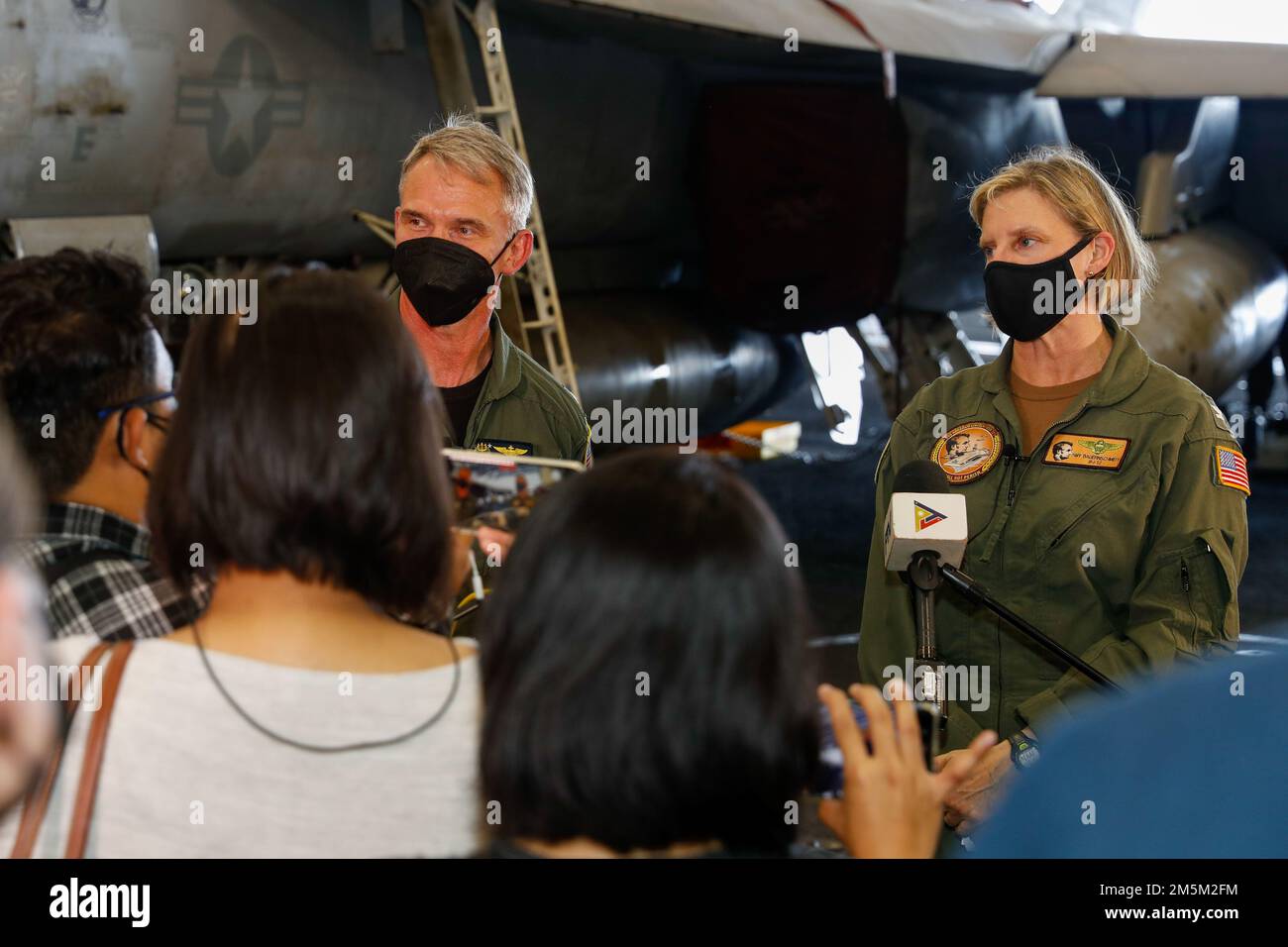 SOUTH CHINA SEA (March 24, 2022) Rear Adm. J.T. Anderson, left, commander, Carrier Strike Group ...