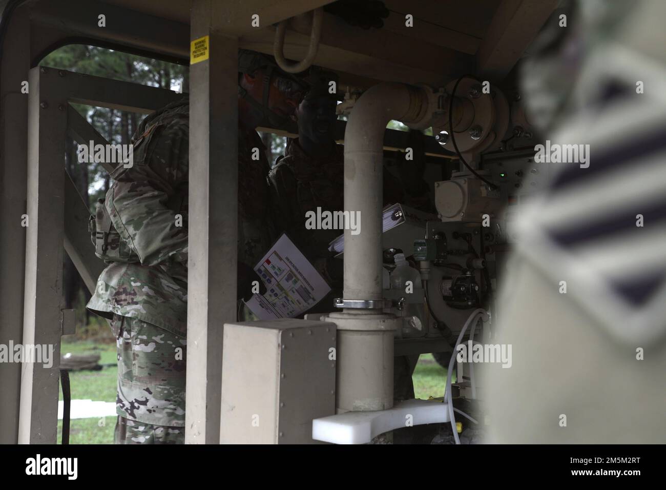 Spc. Merlin Padilla, a water treatment specialist assigned to Alpha ...