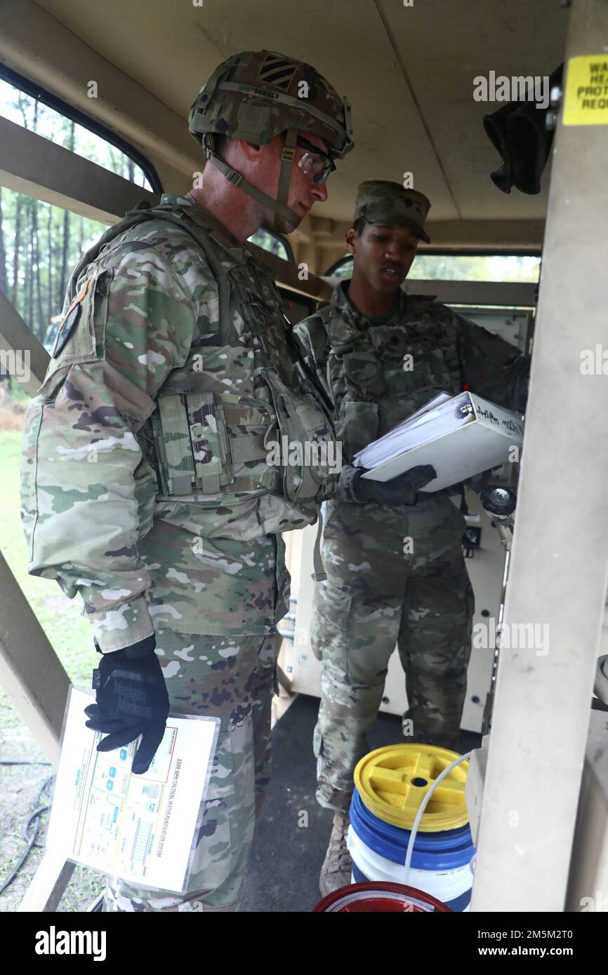 Spc. Merlin Padilla, a water treatment specialist assigned to Alpha ...