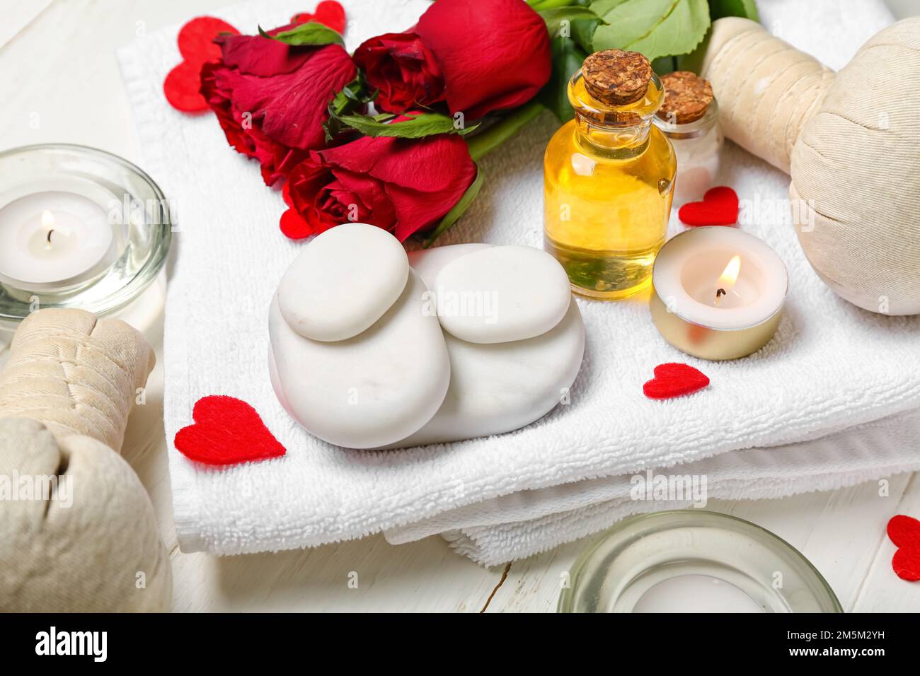 Spa composition for Valentine's Day with stones, roses and candles on ...