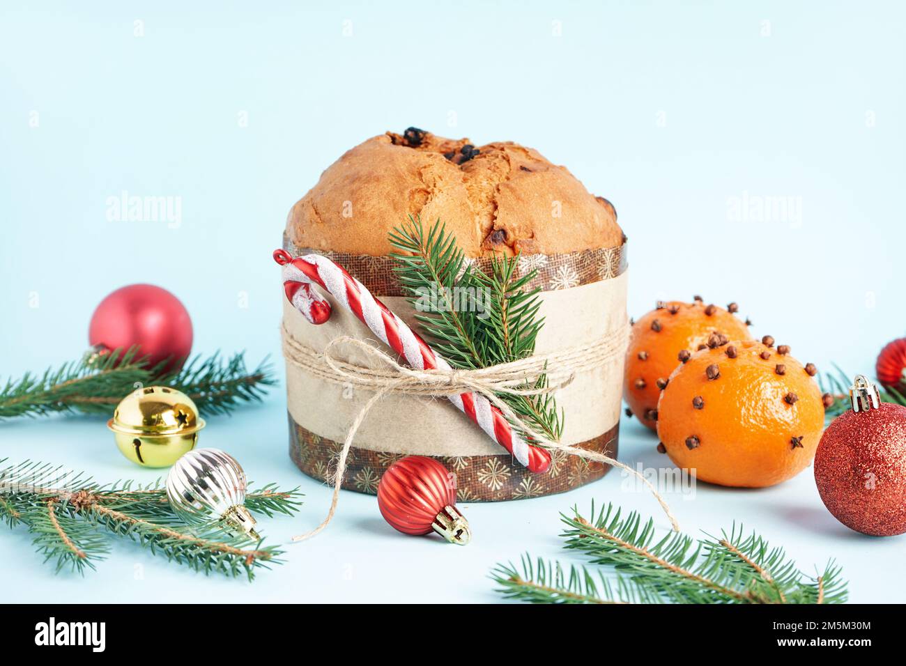 Tasty Panettone with Christmas decor on blue background Stock Photo - Alamy