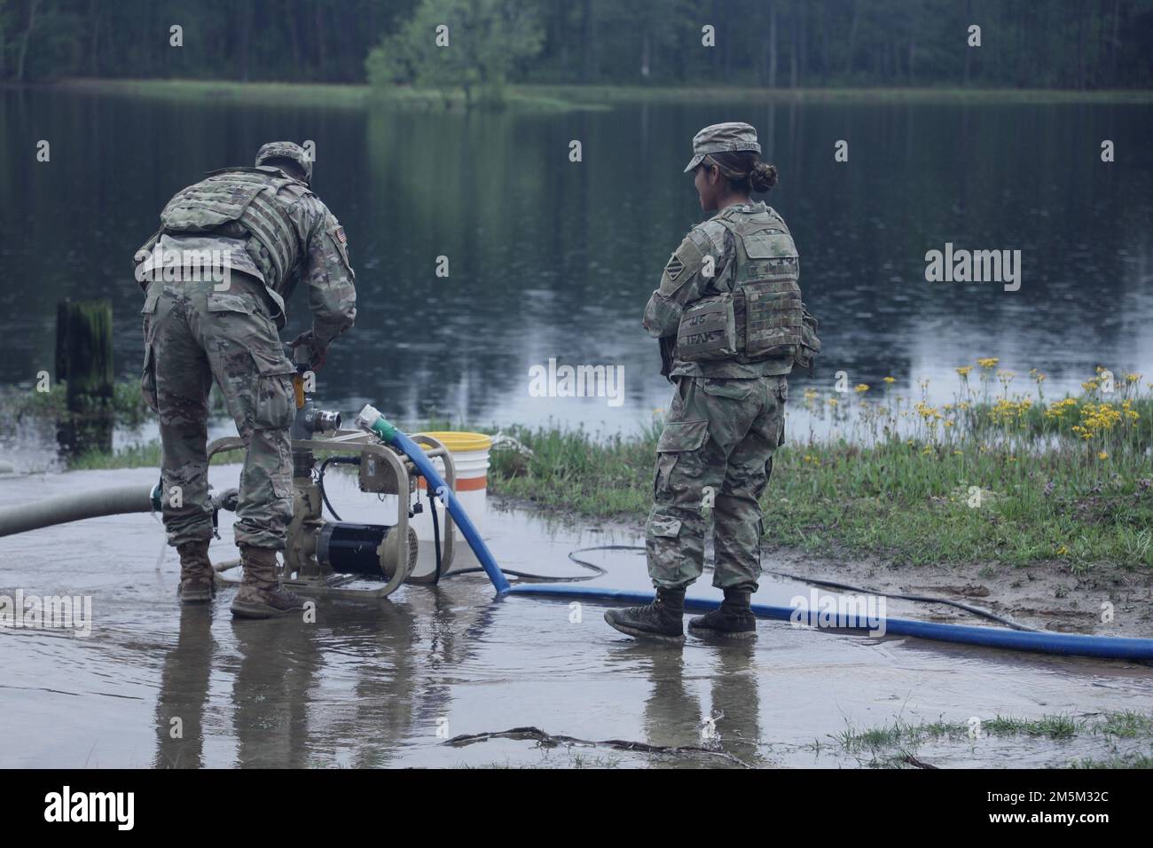 Sgt. David Nelson and Spc. Loraille Badillo, water treatment ...