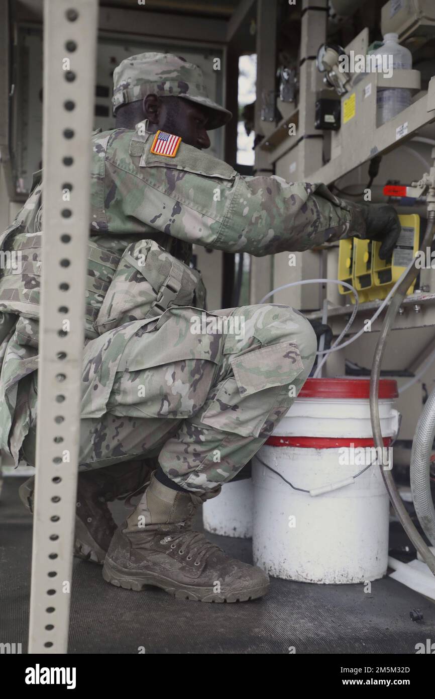 Pfc. Nigel Dundas, a water treatment specialist assigned to Alpha ...