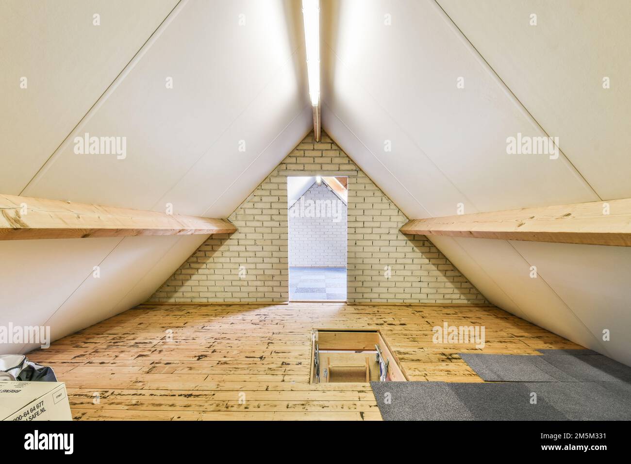 the inside of a building with wood flooring and exposed walls in an ...