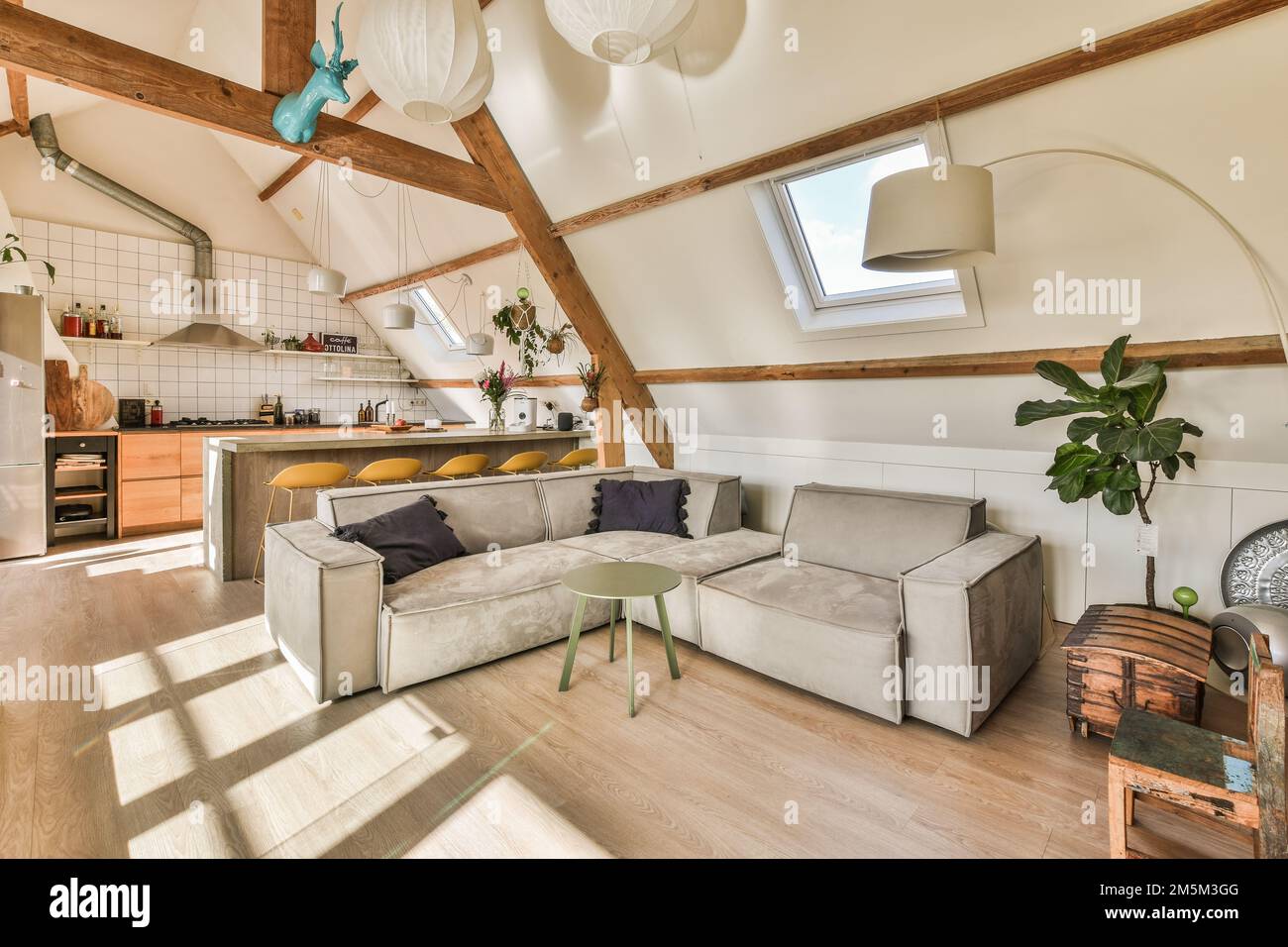 a kitchen and living room in an attic style home with white walls ...