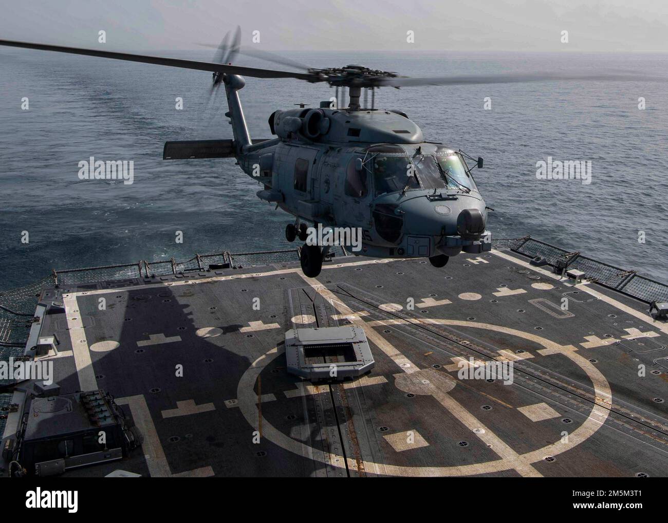 ARABIAN GULF (March 24, 2022) An MH-60R Sea Hawk helicopter, attached ...