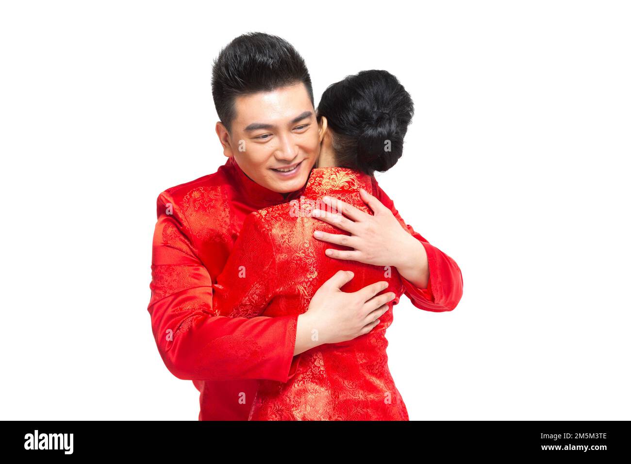 Chinese New Year tang suit man hug mother Stock Photo - Alamy