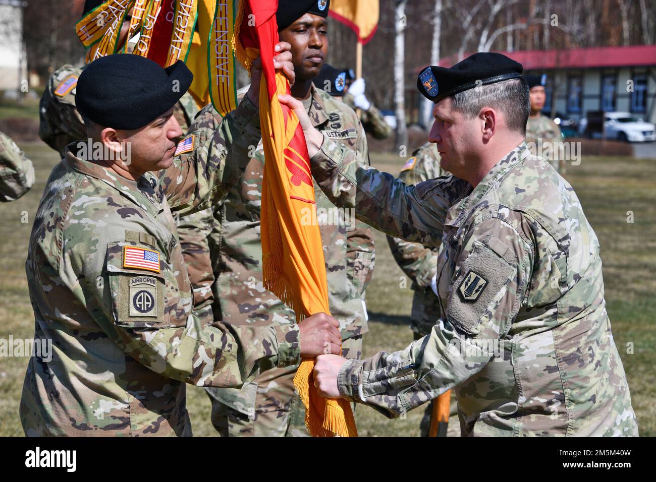 The 41st Field Artillery Brigade’s Commander U.S. Army Col. Daniel Miller, right, hands the unit ...