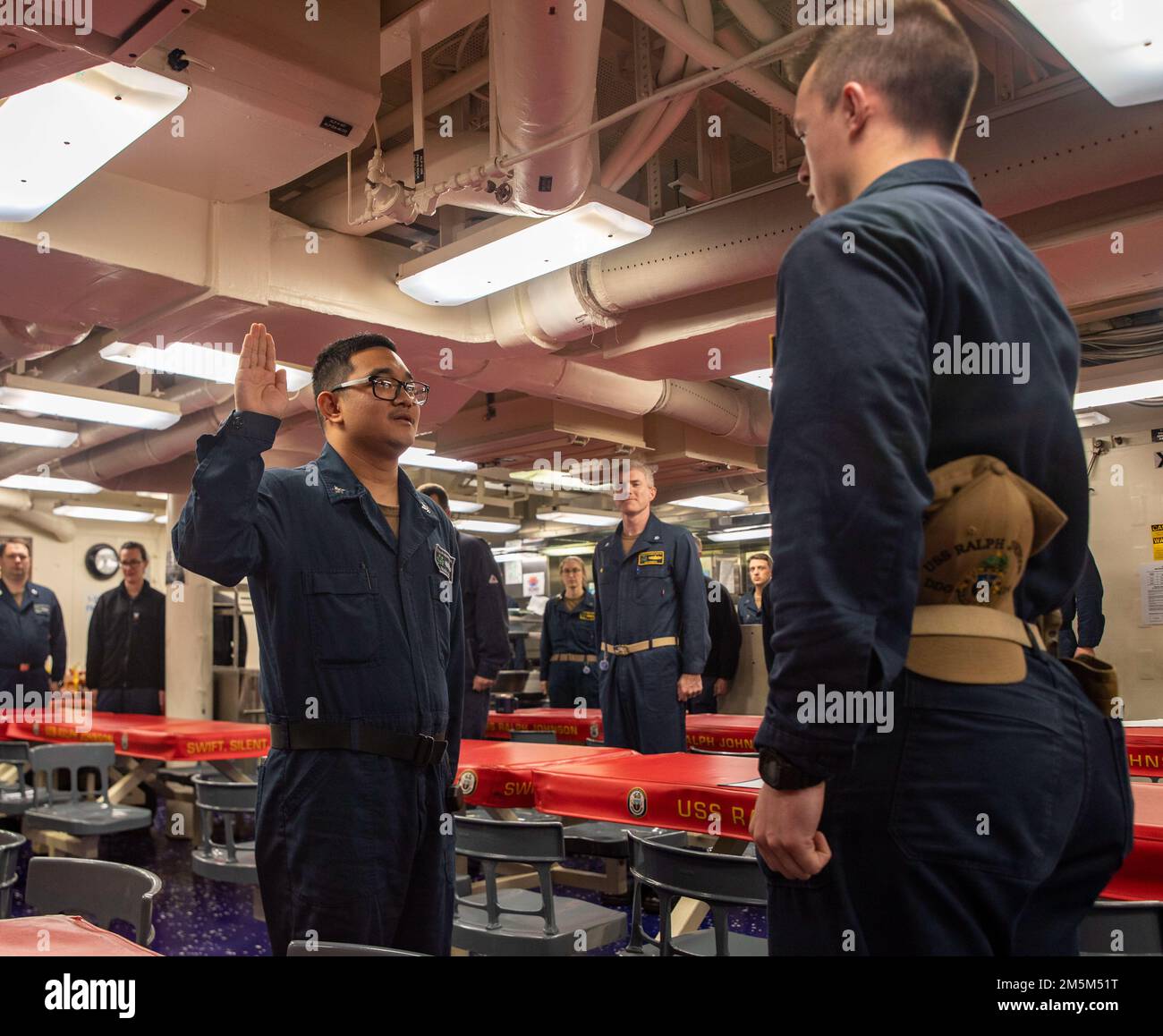 OKINAWA, Japan (March 24, 2022) Specialist 2nd Class Alex Cabico (left ...