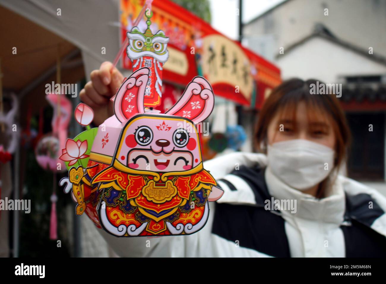 SUZHOU, CHINA - DECEMBER 30, 2022 - Visitors buy and display rabbit ...