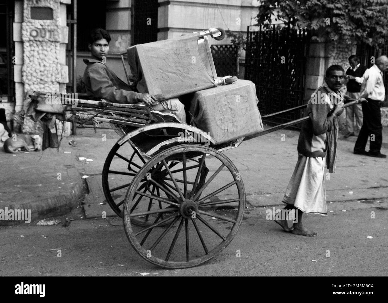 Kolkata hand pulled rickshaw Black and White Stock Photos & Images - Alamy