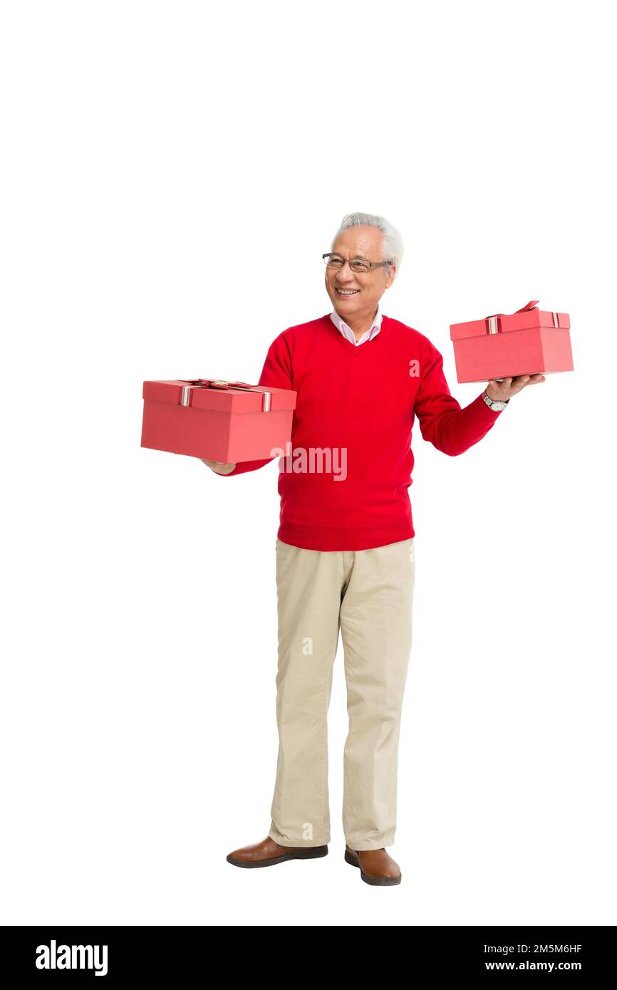 Shed older men with gift box Stock Photo - Alamy