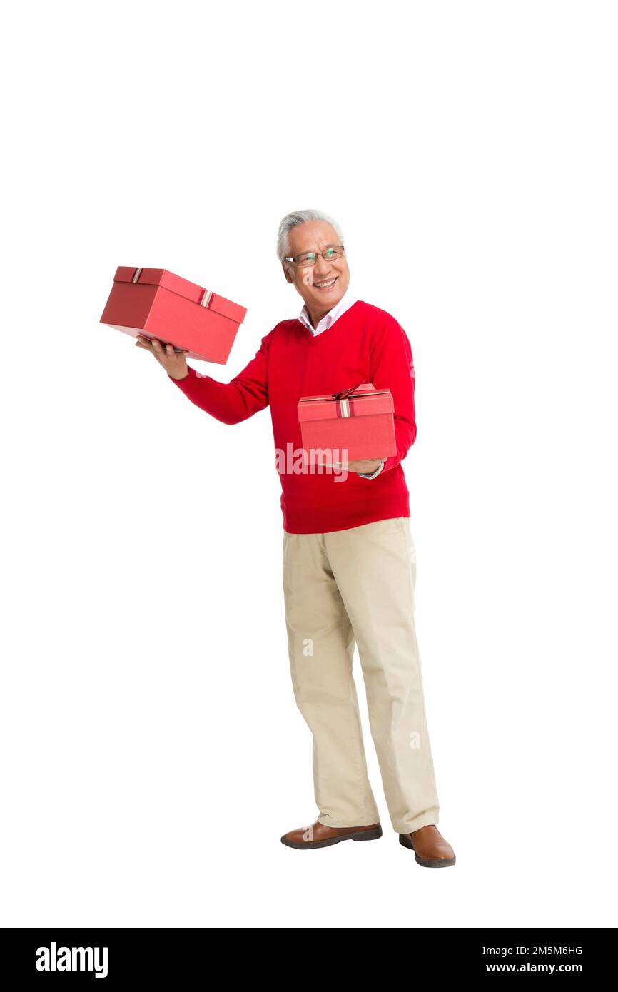 Shed older men with gift box Stock Photo - Alamy