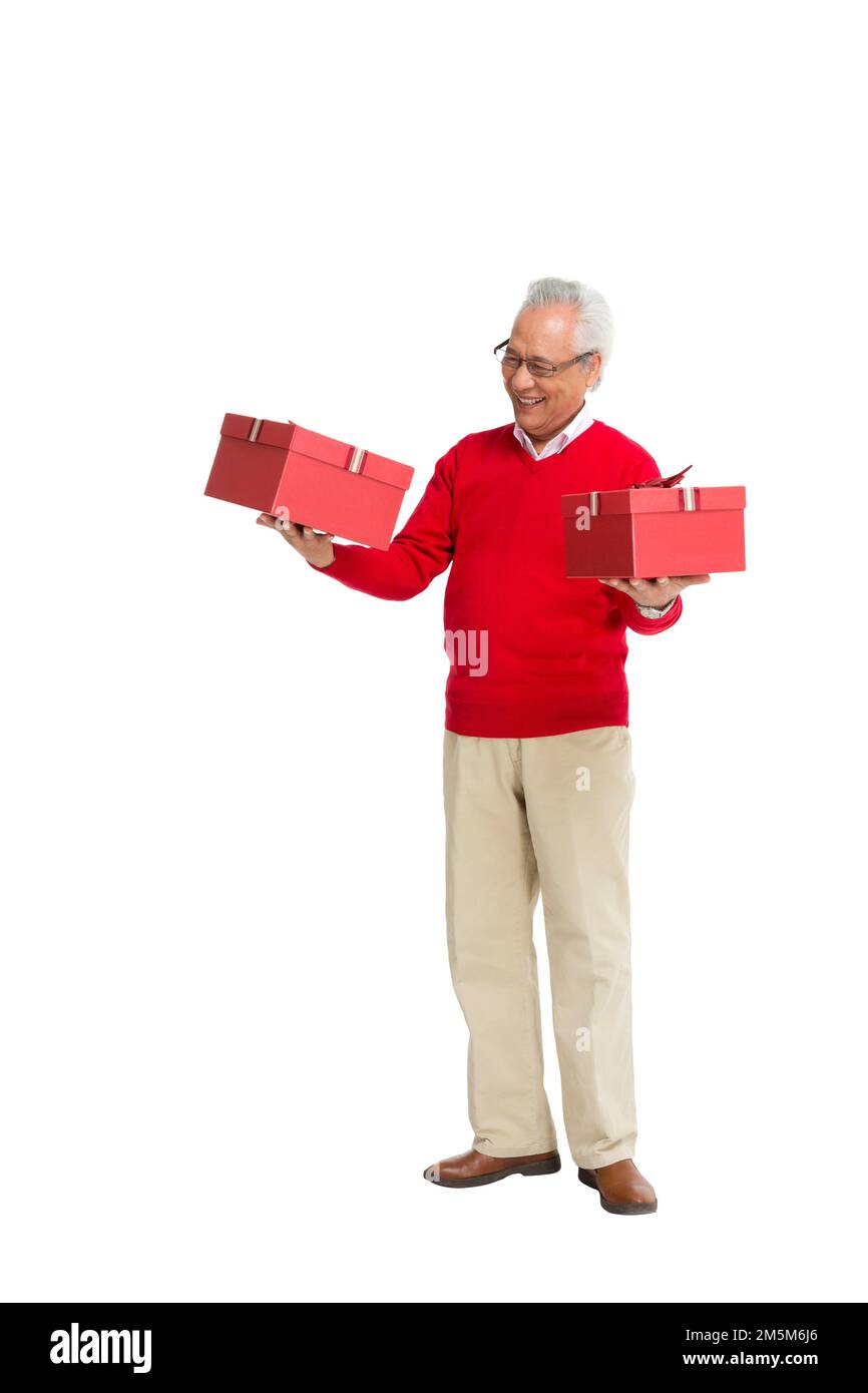 Shed older men with gift box Stock Photo - Alamy