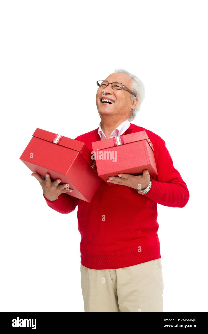 Shed older men with gift box Stock Photo - Alamy