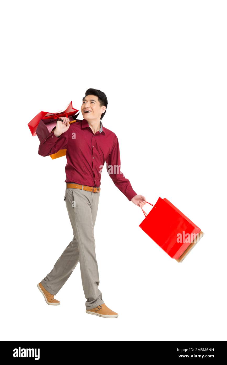 Shed on young man carrying a shopping bag Stock Photo - Alamy Shed on young man carrying a shopping bag Stock Photo - Alamy