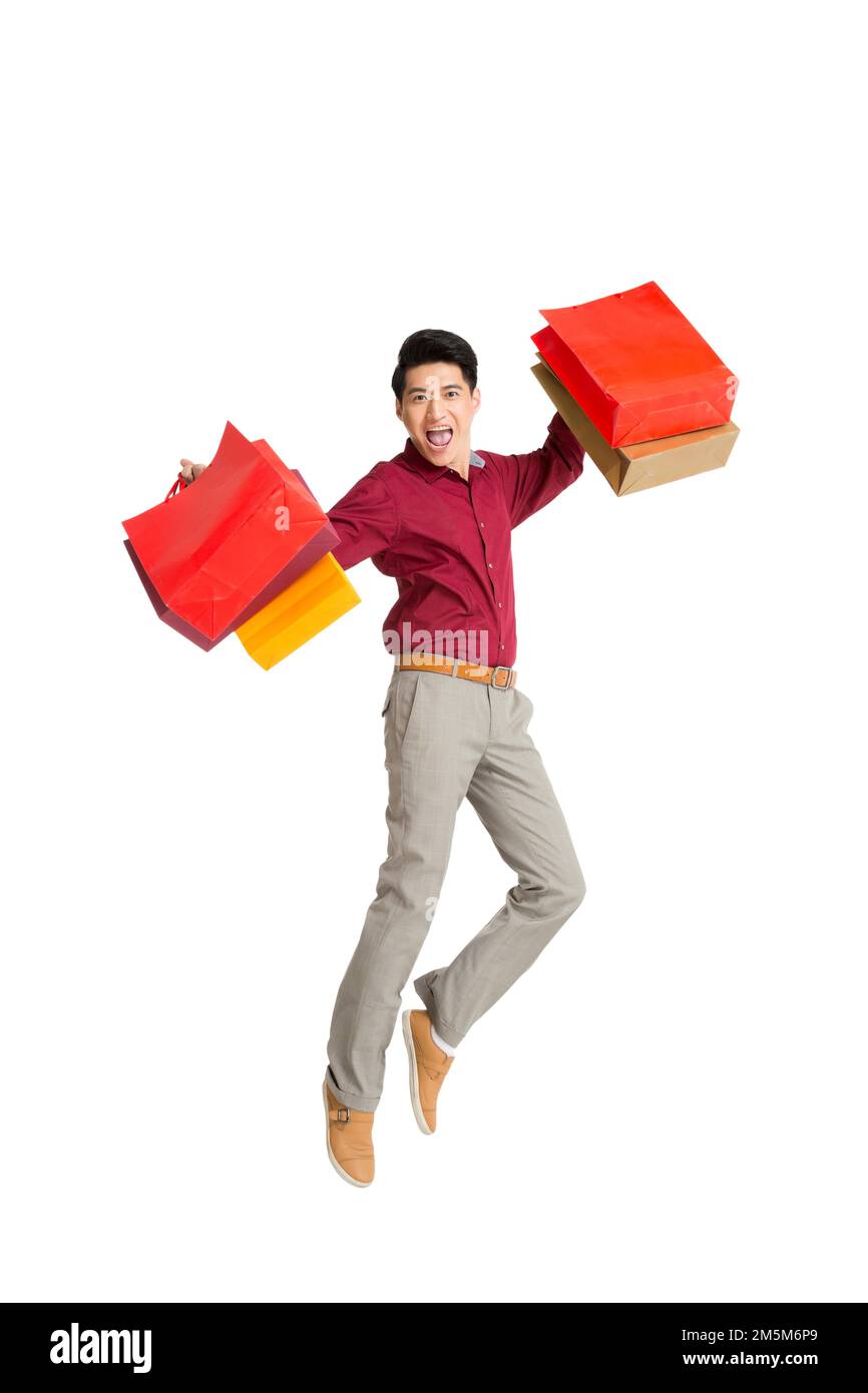 Shed on young man carrying a shopping bag Stock Photo - Alamy Shed on young man carrying a shopping bag Stock Photo - Alamy