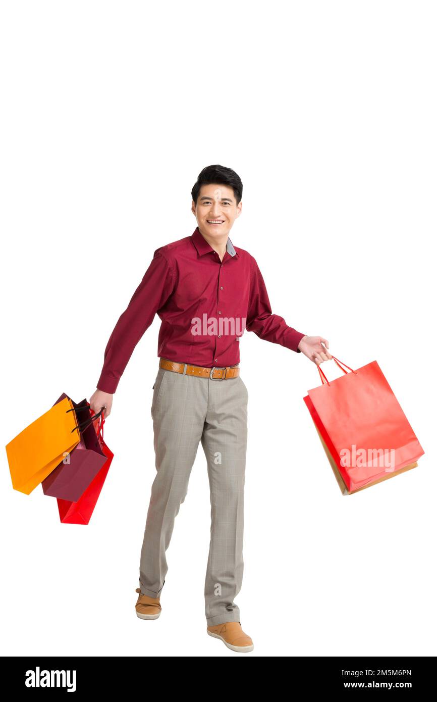 Shed on young man carrying a shopping bag Stock Photo - Alamy Shed on young man carrying a shopping bag Stock Photo - Alamy