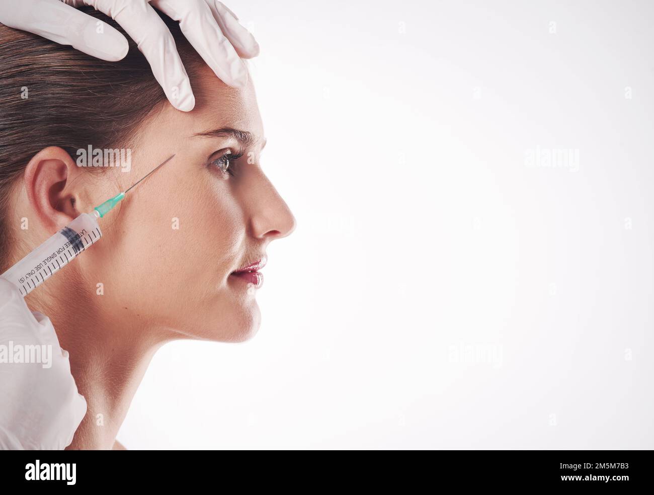 Getting a little help from botox. Studio shot of an attractive young ...