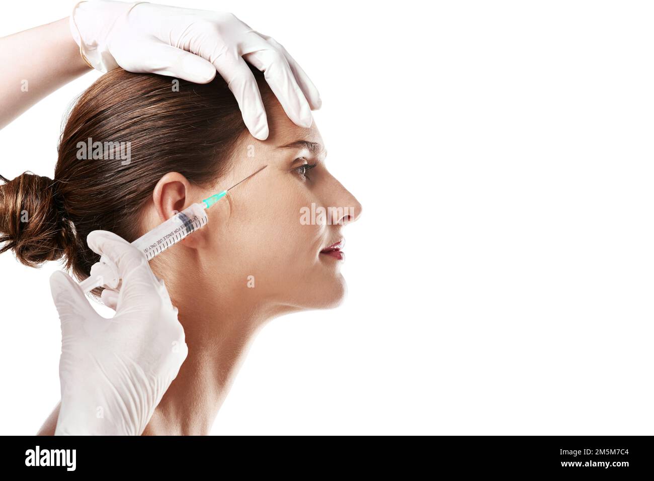 Taking extra measures. Studio shot of an attractive young woman getting ...