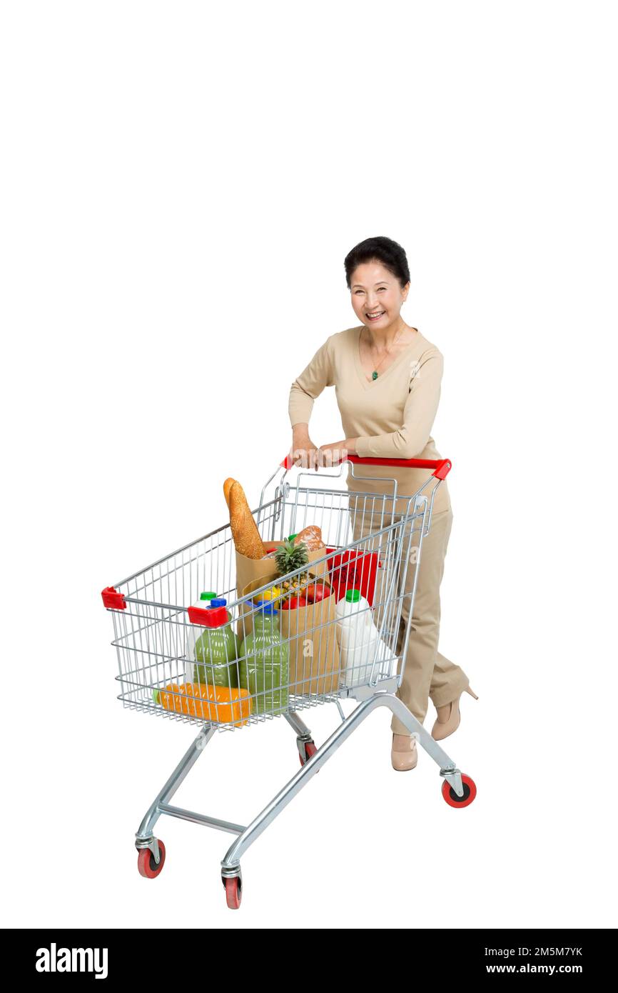 Tent to middle-aged and old women push the shopping cart Stock Photo ...
