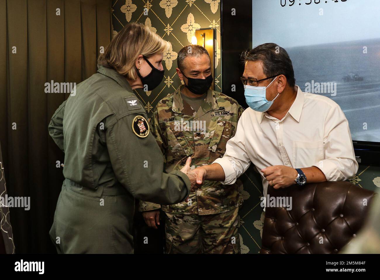 SOUTH CHINA SEA (March 24, 2022) Capt. Amy Bauernschmidt, left ...