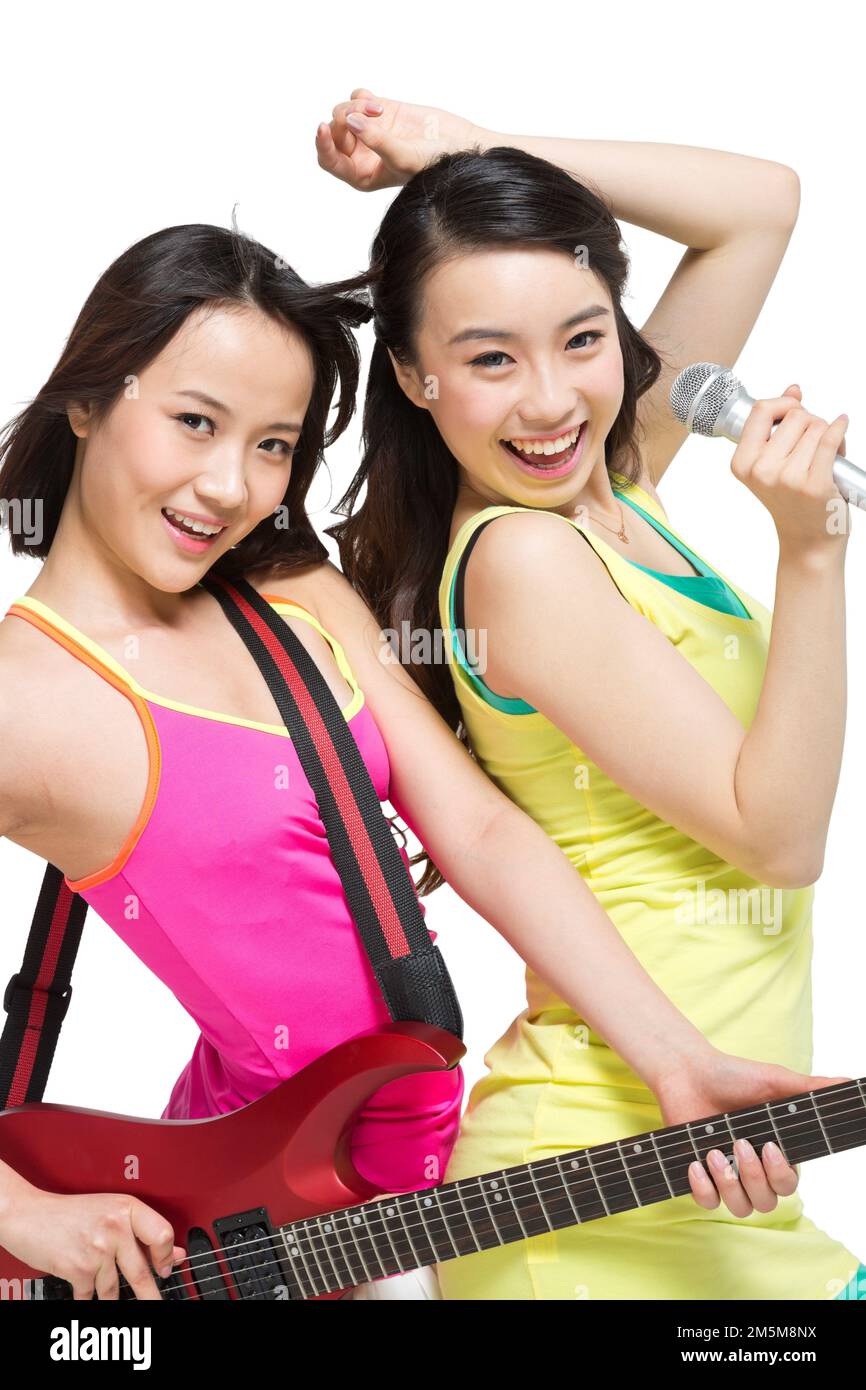 Fashion dynamic young people play the guitar singing Stock Photo - Alamy