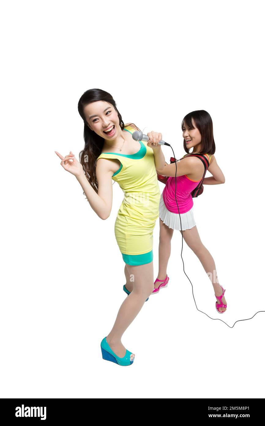 Young woman dancing singing Cut Out Stock Images & Pictures - Alamy