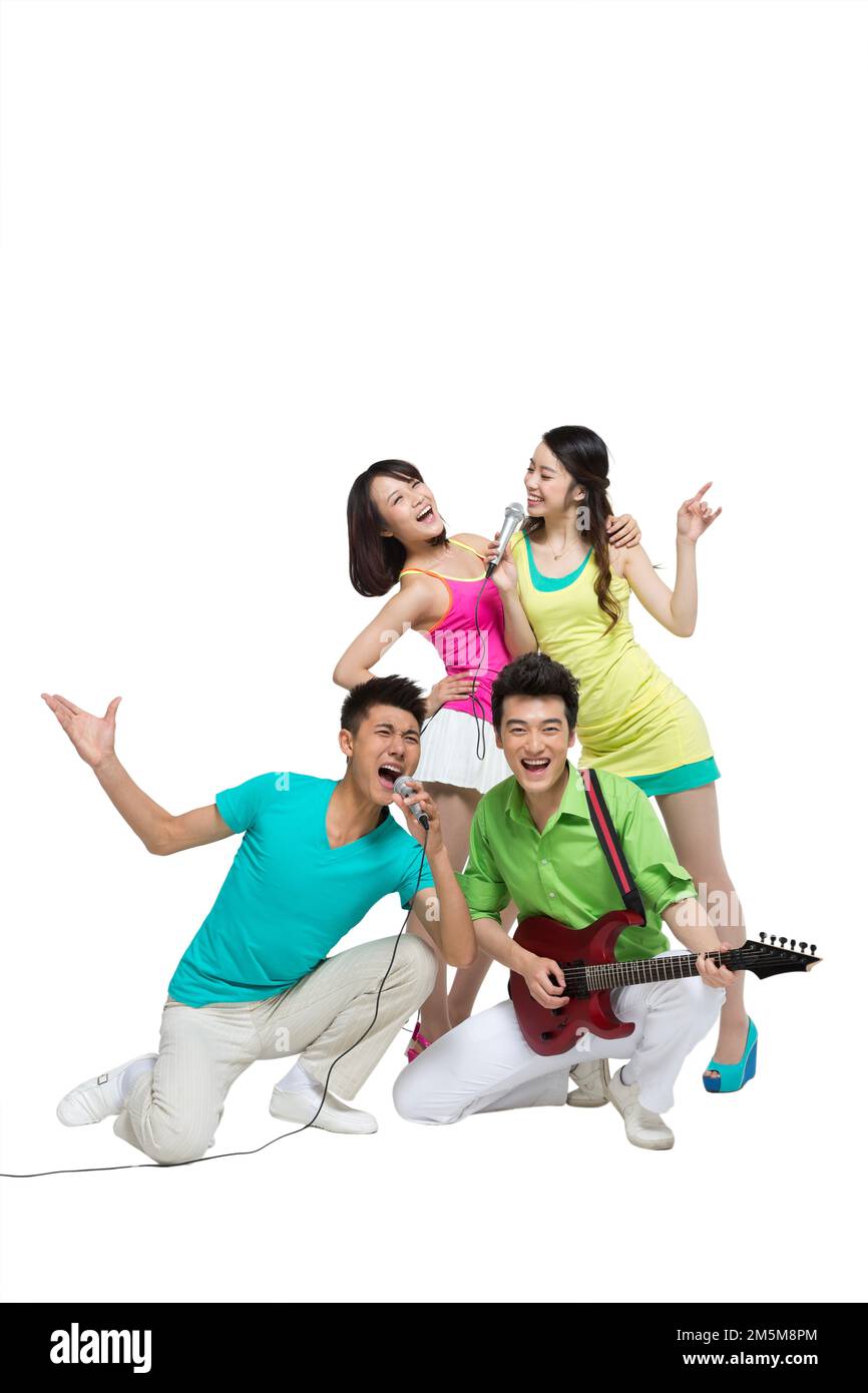 Fashion dynamic young people play the guitar singing Stock Photo - Alamy