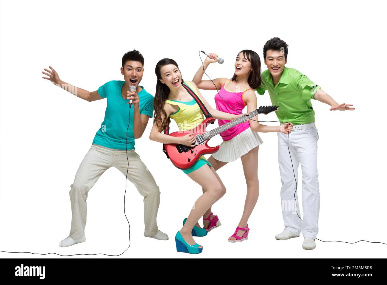 Fashion dynamic young people play the guitar singing Stock Photo - Alamy