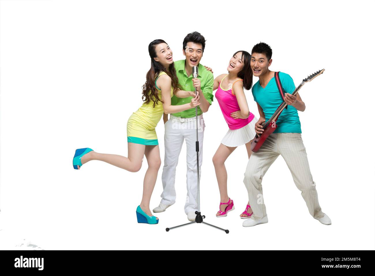 Fashion dynamic young people play the guitar singing Stock Photo - Alamy