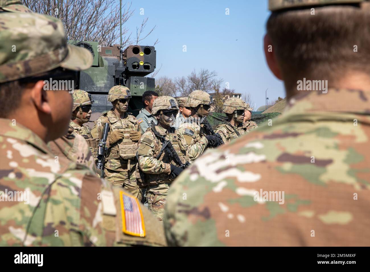 U.S. Army Soldiers, along with NATO Allies and Partners, receive a ...